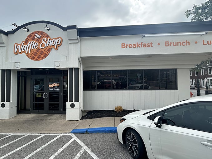 The iconic orange waffle sign beckons like a breakfast lighthouse, guiding hungry souls to this Bellefonte treasure. No fancy frills, just the promise of morning magic.