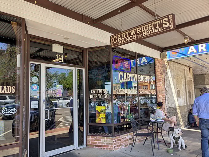 The brick facade of Cartwright's Ranch House promises authentic Texas dining with its vintage-style mural that practically screams "Come get your comfort food here, partner!"