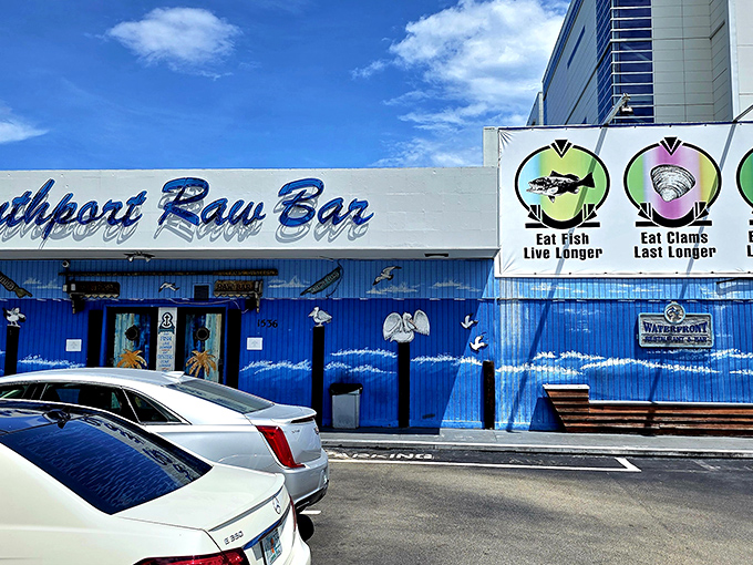 The blue facade of Southport Raw Bar isn't just a building—it's a promise of seafood salvation waiting inside.