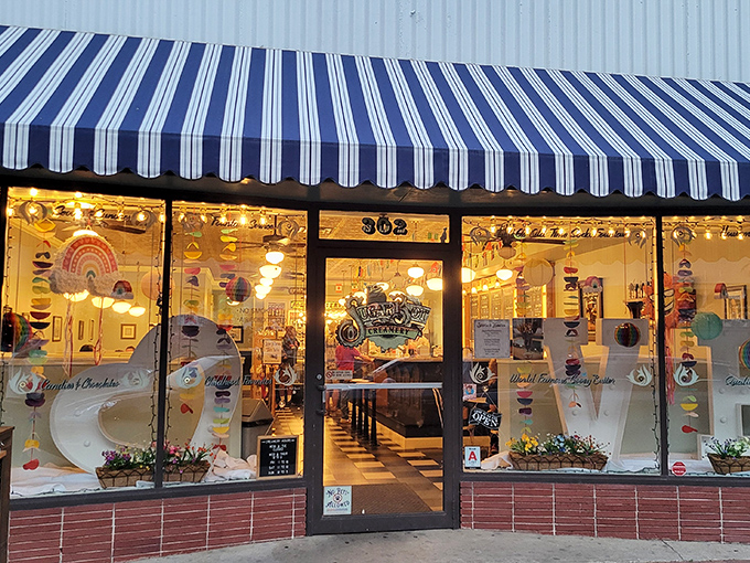That blue and white striped awning isn't just decoration—it's a beacon of sweetness calling you into a world where calories don't count and joy is served by the scoop.