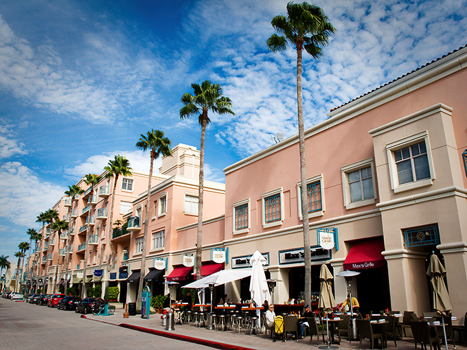 Mizner Park's pastel facades and outdoor cafés create a Mediterranean fantasy where your wallet can actually survive the experience.