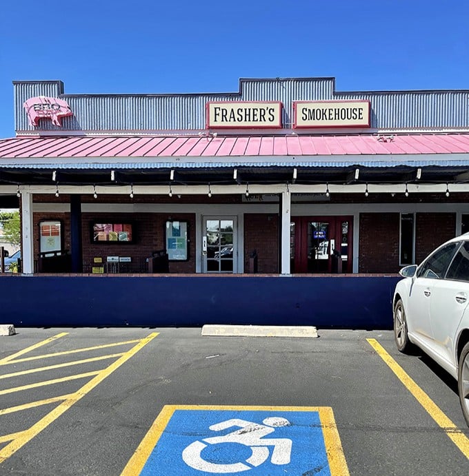 That iconic pink roof and pig sign – the barbecue equivalent of Batman's signal in the sky, calling hungry Phoenicians to gather.