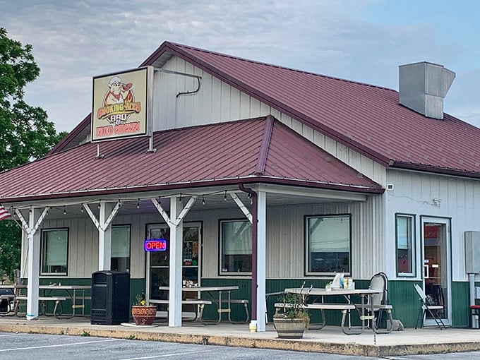 The white clapboard exterior with burgundy metal roof isn't trying to impress anyone—until you smell what's happening inside. Rural Pennsylvania BBQ perfection awaits.
