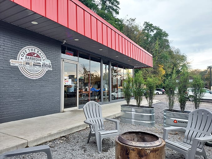 The bright red awning of Off the Rails isn't just eye-catching—it's nature's way of signaling "seriously good barbecue ahead," like a cardinal leading you to deliciousness.
