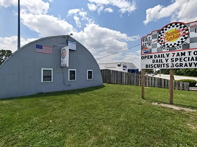 The unmistakable Quonset hut silhouette of Charlie Parker's stands like a breakfast beacon against the Illinois sky, promising comfort food salvation to hungry travelers.