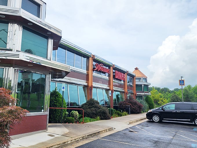 The gleaming exterior of Nautilus Diner stands like a beacon for hungry travelers, its distinctive blue-trimmed architecture promising comfort food paradise within.