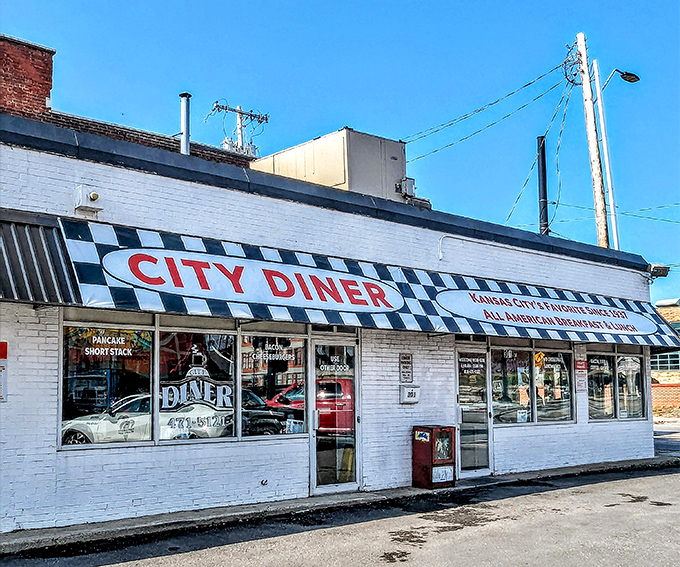 The classic black-and-white checkered awning isn't just decoration—it's a beacon of breakfast hope for hungry Kansas Citians seeking their morning salvation.