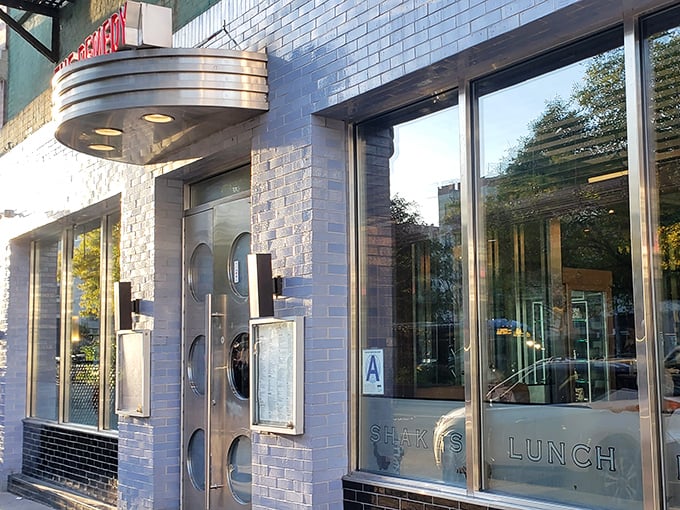 The blue-brick facade of Remedy Diner beckons like a portal to simpler times, complete with those iconic round porthole windows that practically wink at passersby.