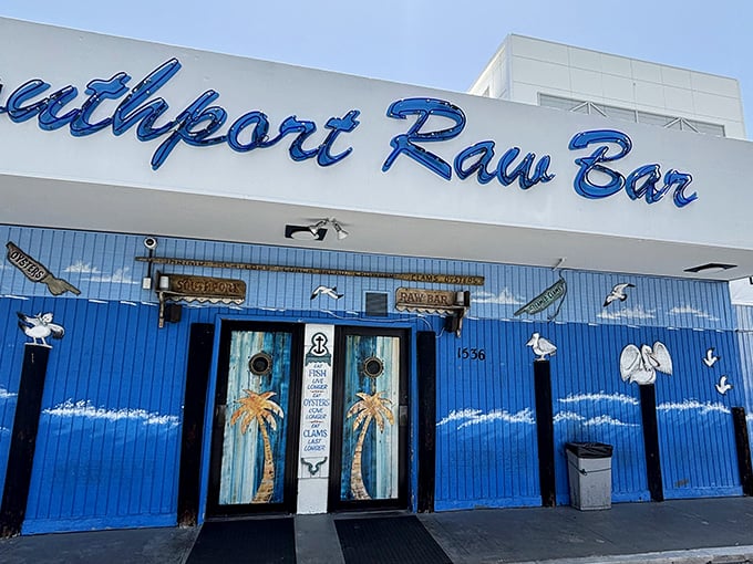 The blue facade of Southport Raw Bar isn't trying to impress anyone—it's too busy promising longer life through seafood consumption. Who can argue with that logic?