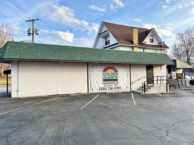 That green roof whispers promises of comfort food that'll make you forget your diet existed.