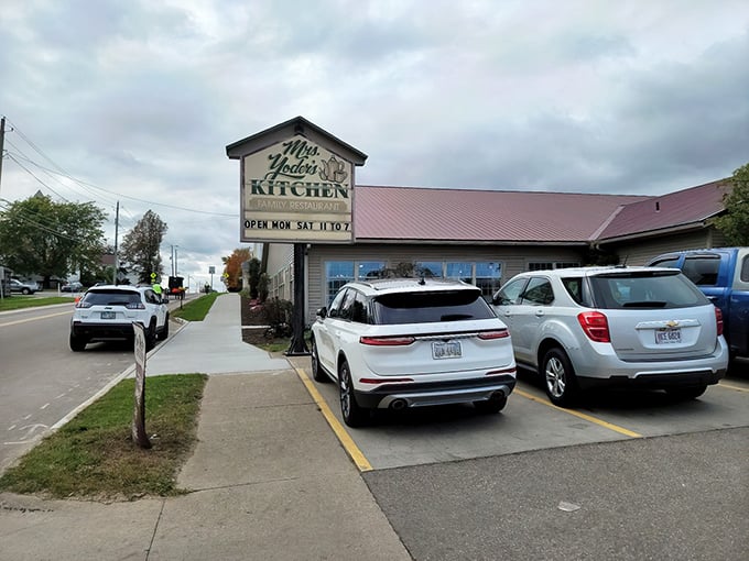 Beneath the wide Ohio sky, Mrs. Yoder’s Kitchen sign beckons like a hug, promising comfort food that soothes every care.