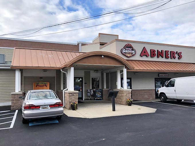 Abner's welcoming facade promises seafood treasures within. The copper-toned roof and stone accents say "Maryland crab house" before you even step inside.