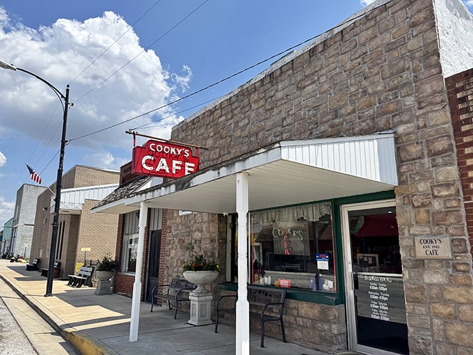 The unassuming storefront of Cooky's Cafe stands like a time capsule on Golden City's main street, its vintage red sign a beacon for hungry travelers.