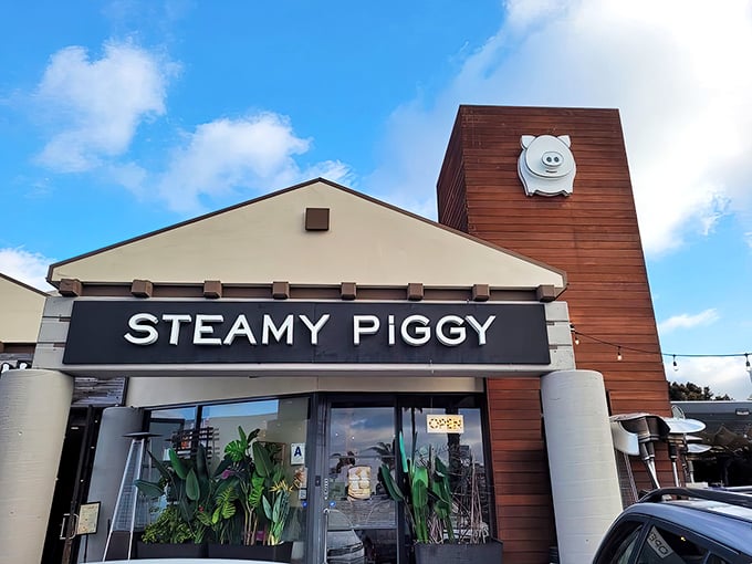 The adorable piggy logo perched atop this wooden tower isn't just cute—it's a beacon calling hungry souls to San Diego's dumpling paradise.