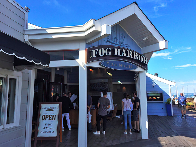 Where tourists become regulars and locals pretend they're tourists—Fog Harbor's entrance buzzes with the anticipation of seafood worth waiting for.