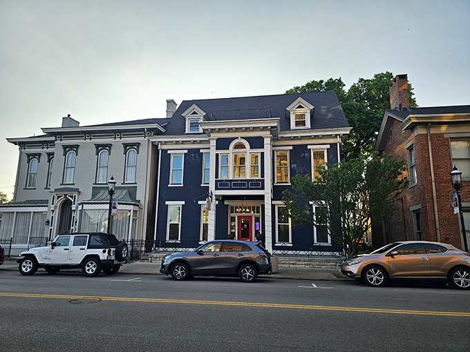 The stately navy blue exterior of The Swire Inn stands proudly on Middletown's Central Avenue, promising culinary adventures behind its historic façade.