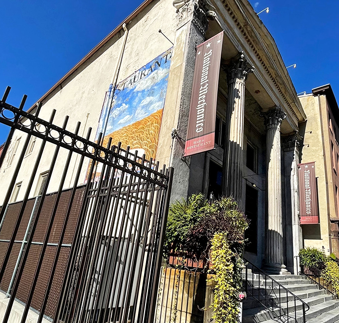 Banking on good taste! National Mechanics' grand columns and historic façade hint at its past life as a 19th-century financial institution before becoming a culinary landmark.