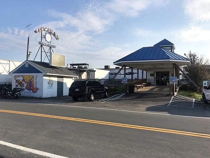 The iconic Captain Billy's sign stands tall against the Maryland sky, like a lighthouse guiding hungry seafood lovers to their destination.