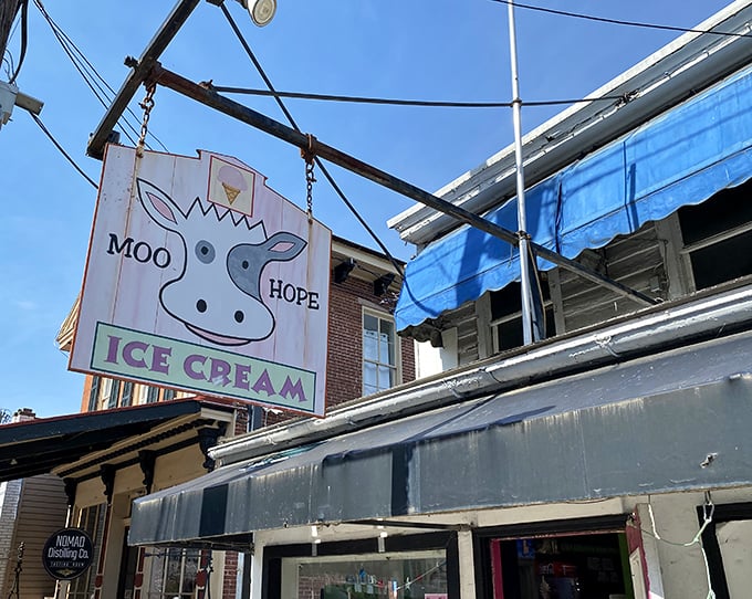 The whimsical cow sign hanging above Moo Hope Ice Cream promises dairy delights that'll make you forget every diet resolution you've ever made.
