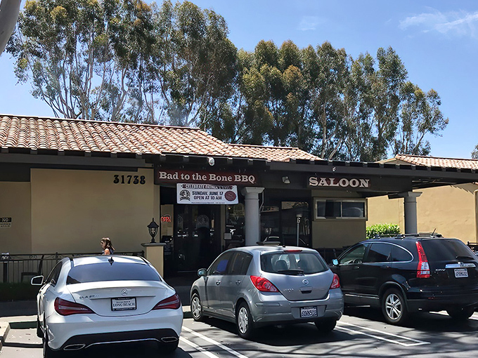 The unassuming exterior of Bad to the Bone BBQ belies the smoky treasures within. Mission-style architecture meets meat paradise in San Juan Capistrano.