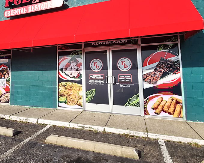 The bright turquoise building with its bold red awning isn't trying to hide – it's proudly announcing that culinary adventure awaits inside Felynn Oriental Restaurant. 