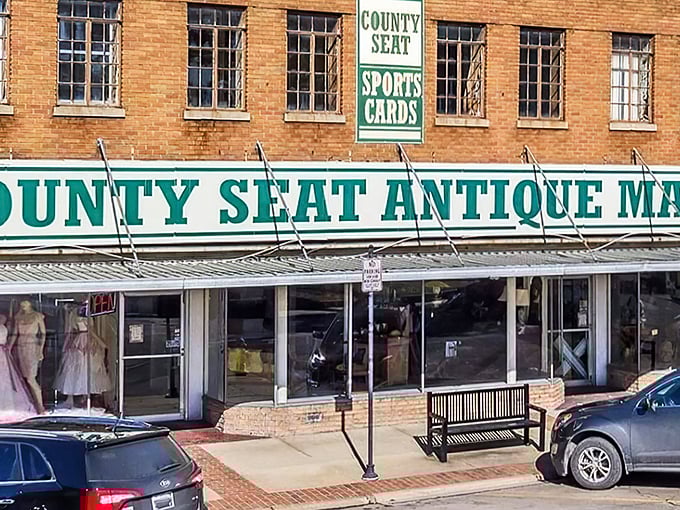 The brick facade of County Seat Antique Mall beckons treasure hunters with its vintage charm and promise of discoveries waiting just beyond those glass doors.