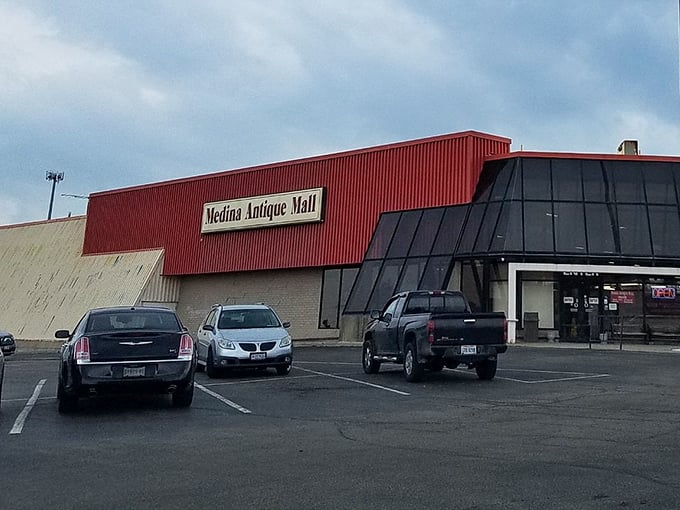 The bright red exterior of Medina Antique Mall stands like a beacon for treasure hunters. Inside awaits a labyrinth of memories and potential discoveries.