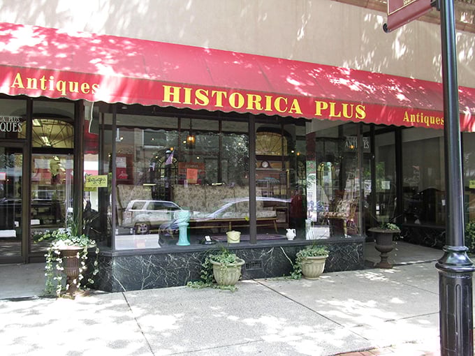 The iconic red awning of Historica Plus beckons like a portal to the past. Downtown Clearfield's time machine disguised as a storefront.