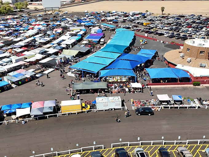 From above, Glendale Public Market unfolds like a treasure map—rows of stalls creating a colorful patchwork of bargains beneath the Arizona sky.