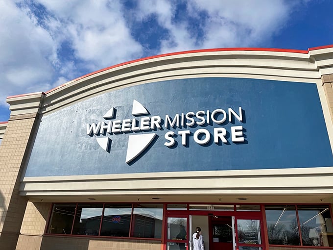 The iconic blue storefront of Wheeler Mission Store stands out against Indiana skies, promising adventure for thrift enthusiasts and bargain hunters alike.