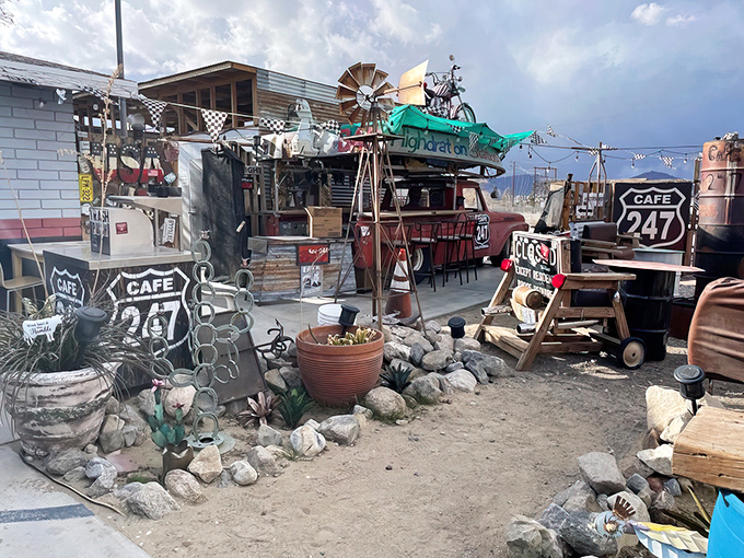 Out front feels like Mad Max meets Route 66—quirky desert charm promising cold drinks and smoky barbecue dreams.