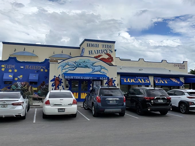 The blue facade of High Tide Harry's proudly announces "WHERE LOCALS EAT" – the Florida equivalent of a Michelin star and the first clue you've found seafood gold.
