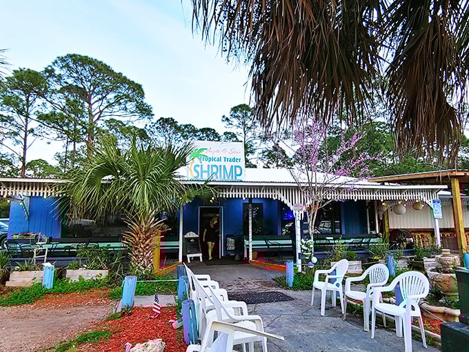 A welcoming entrance framed by lush greenery and casual outdoor seating. This is where Florida locals know to go when seafood cravings hit.