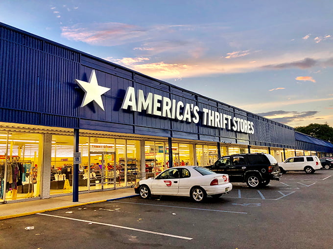 The sunset paints this thrift store cathedral in golden hues, where bargain hunting becomes an evening adventure worth savoring.