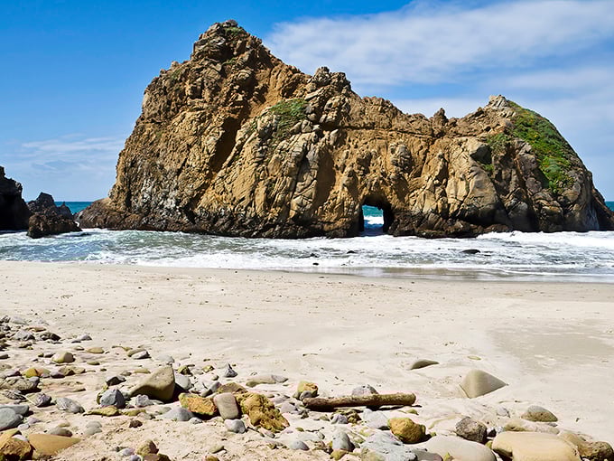 Keyhole Rock stands like a sentinel at Pfeiffer Beach, its natural arch carved by centuries of persistent waves and coastal winds.