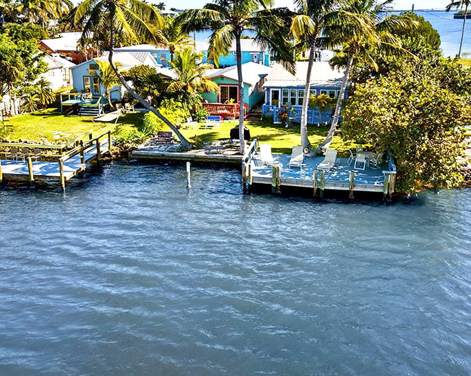 Waterfront living doesn't get more idyllic than this – colorful cottages nestled among swaying palms with private docks just steps from your door.