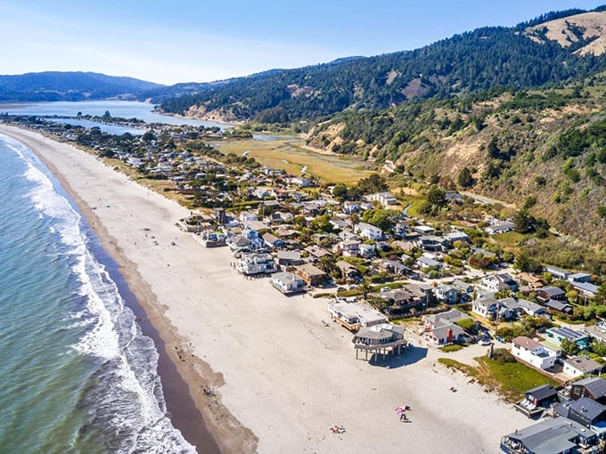 From this bird's-eye view, you can almost hear the waves whispering secrets to the shore. Stinson's crescent beach cradles a community that time forgot.