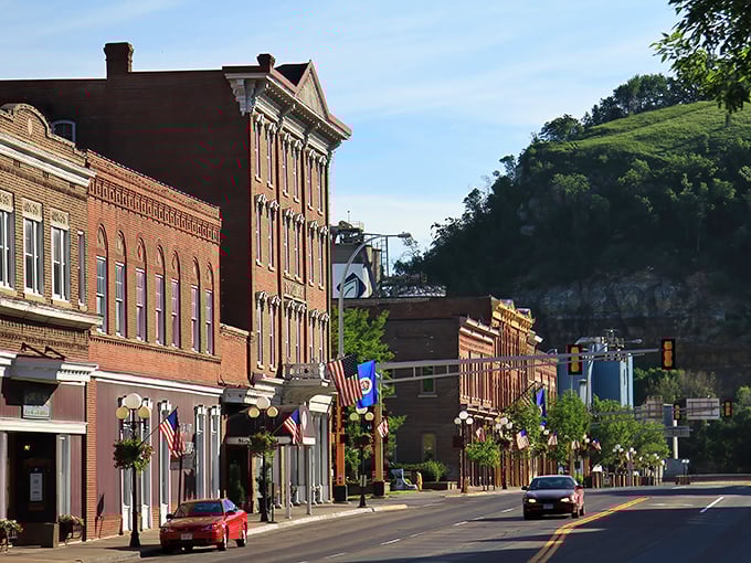 Red Wing's historic downtown nestled against dramatic bluffs – where architecture and nature create the perfect small-town symphony.