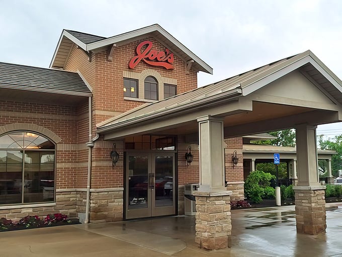 The welcoming brick exterior of Joe's Deli stands ready to embrace hungry visitors, its signature red sign promising delicious things await inside. 