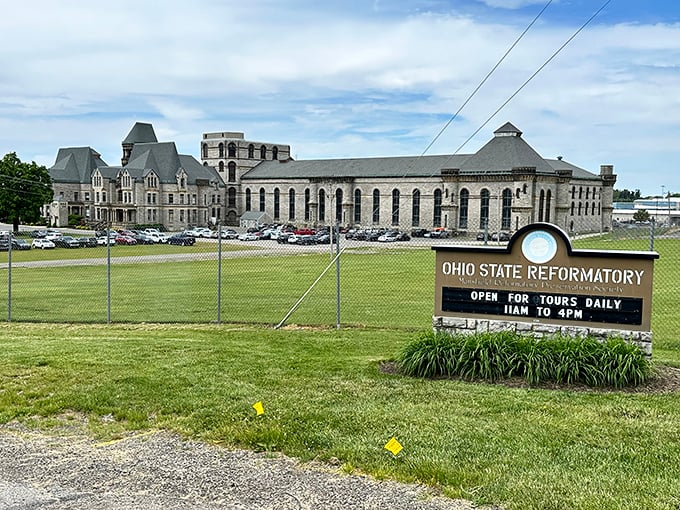 Gothic grandeur meets prison reality at the Ohio State Reformatory. This imposing limestone facade has welcomed visitors, inmates, and Hollywood film crews for generations.