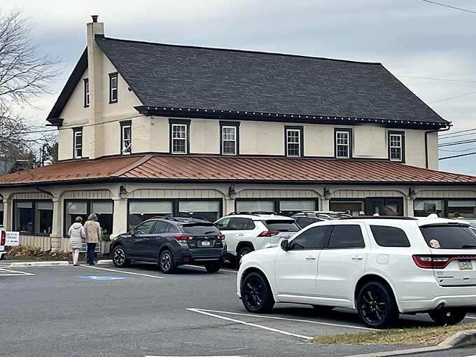The white colonial façade of Brickerville House stands proudly against the Pennsylvania sky, its copper-trimmed porch promising comfort before you even step inside.