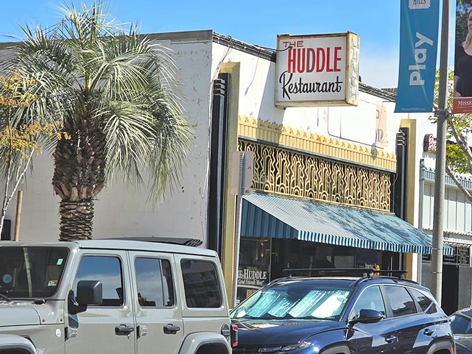 The Huddle's unassuming exterior hides breakfast treasures within, like finding the Ark of the Covenant if it were filled with pancakes.
