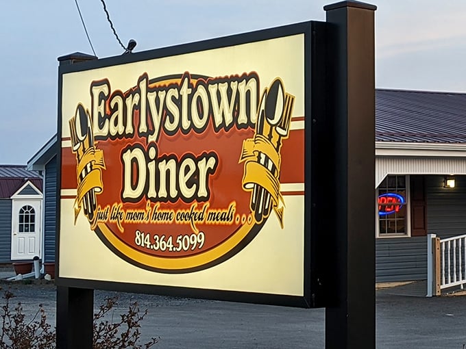 The unassuming exterior of Earlystown Diner welcomes hungry travelers with its charming country porch and promise of home-cooked comfort waiting inside.
