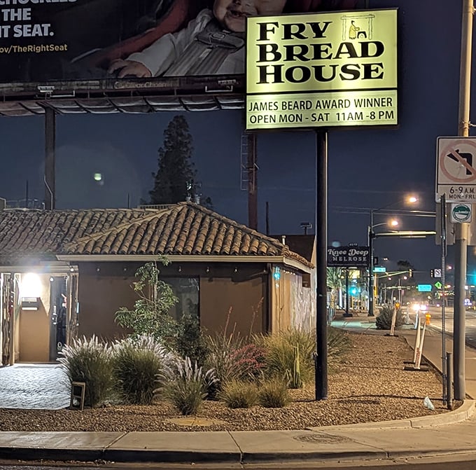The unassuming exterior of Fry Bread House glows with promise at dusk, its James Beard Award proudly displayed like a culinary medal of honor.