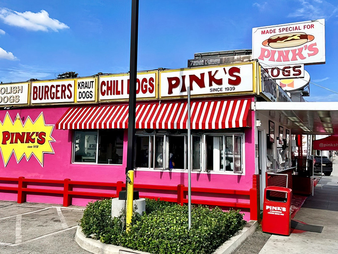 That iconic pink building with red-and-white awnings isn't subtle, but neither is your hunger when you spot Pink's from a block away.