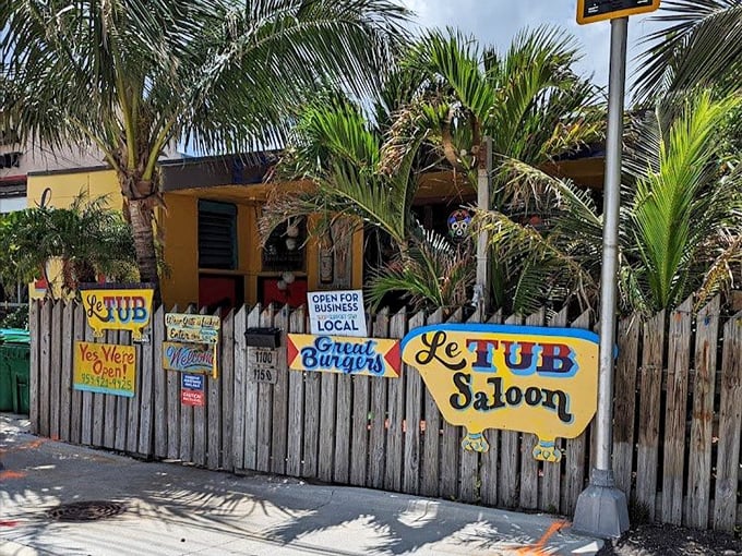 Not your average restaurant decor—Le Tub's wooden fence and bathtub sign are the first clues you've stumbled upon something wonderfully weird and delicious.