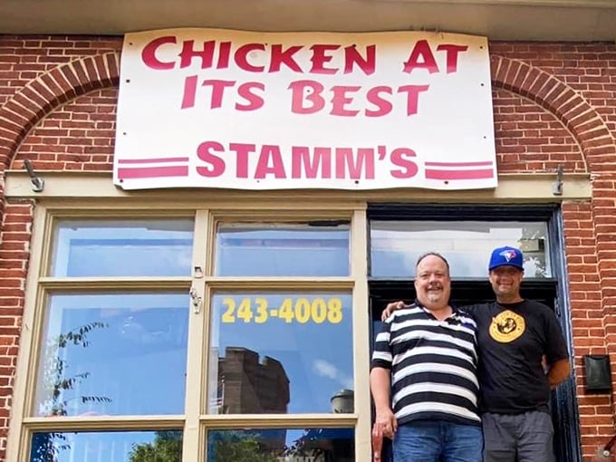 Two friendly faces welcome visitors under the vintage sign that's become a beacon for fried chicken aficionados.