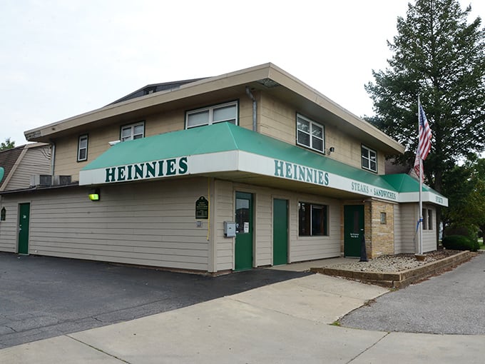 A second view reveals Heinnies' green awning and American flag – a no-nonsense steakhouse that puts substance over style and flavor over fuss.