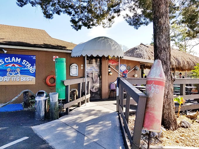 The entrance to Dan's Clam Stand beckons with nautical charm – complete with a buoy marker that practically screams "fresh seafood ahead!"