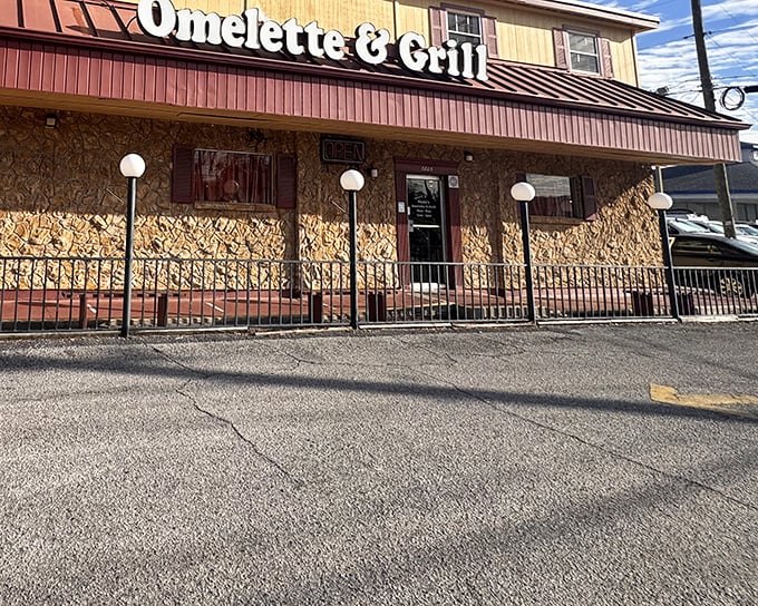 The stone facade and vintage globe lights of Nicki's Omelette & Grill stand as a beacon to breakfast lovers. This Tampa institution promises comfort food without pretension.